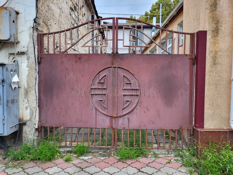 There are Red Iron Gates with Forged Elements on the Street. Stock ...