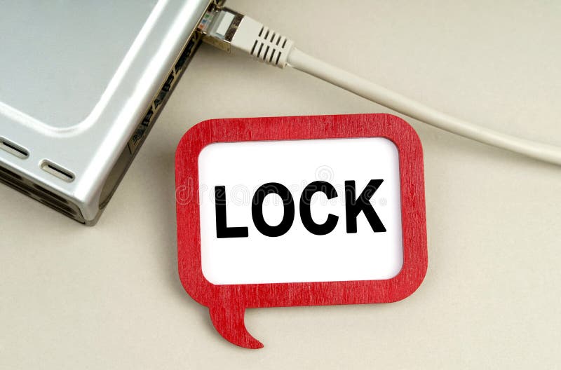 There is a Router Connected To the Network on the Table, Next To a Sign ...