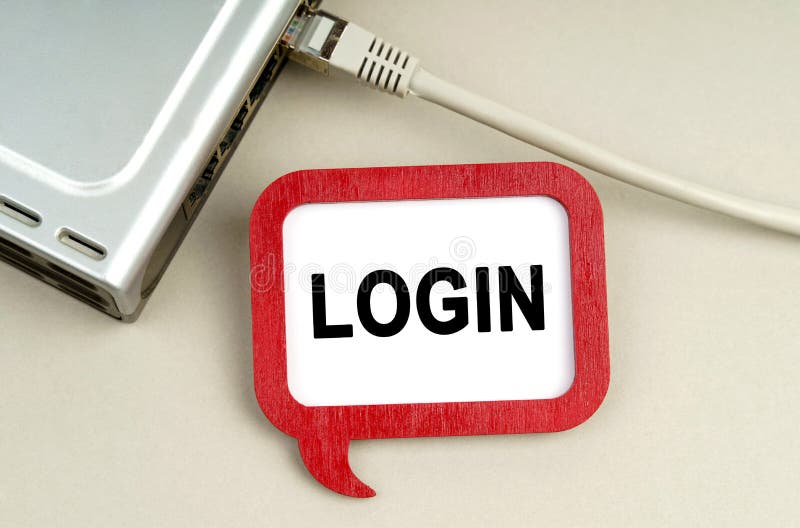 There is a Router Connected To the Network on the Table, Next To a Sign ...