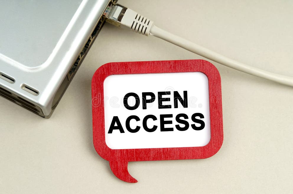 There is a Router Connected To the Network on the Table, Next To a Sign ...