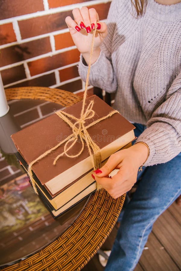 There`s a Stack of Books on the Table.the Books are Tied with String ...