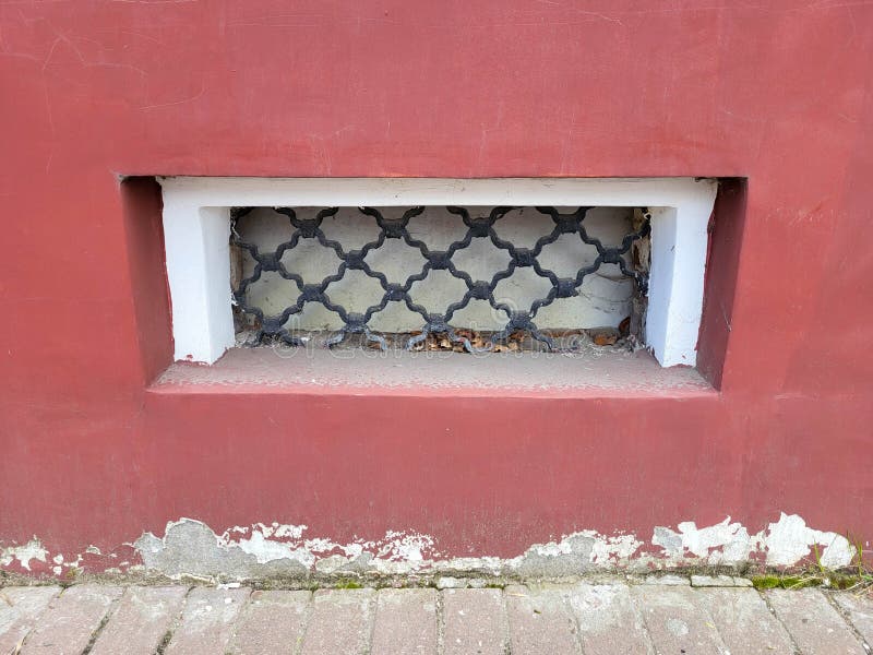 There is a Small Rectangular Window with a Wrought Iron Grille on the ...