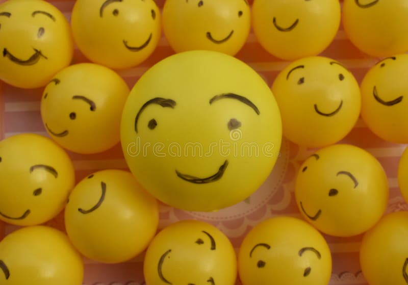 There are Smiley Faces Drawn on Yellow Balls. Stock Photo - Image of ...