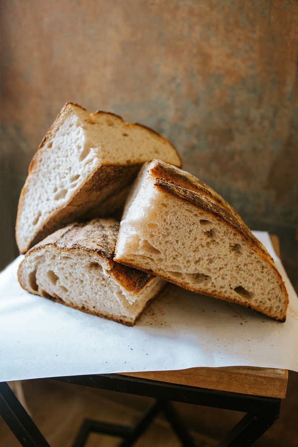 There are Some Bread that is Cut in Half on a Napkin Stock Photo ...