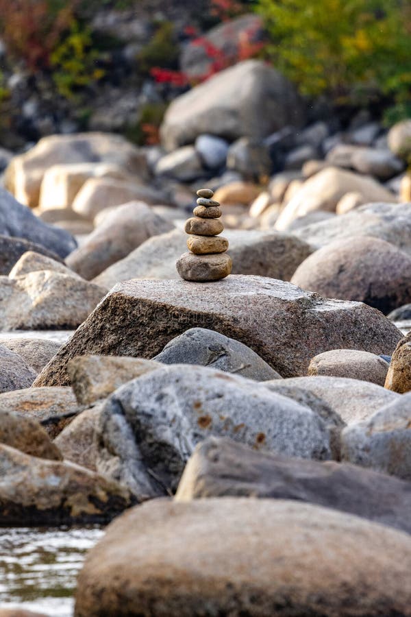 There is a Stack of Rocks Stacked on Each Other at the River Bank Stock ...
