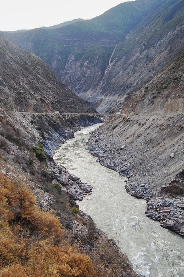 There is a Surging River at the Foot of the Mountain Stock Image ...