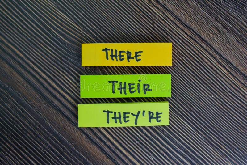There, Their and they`re Write on Sticky Notes Isolated on Wooden Table ...