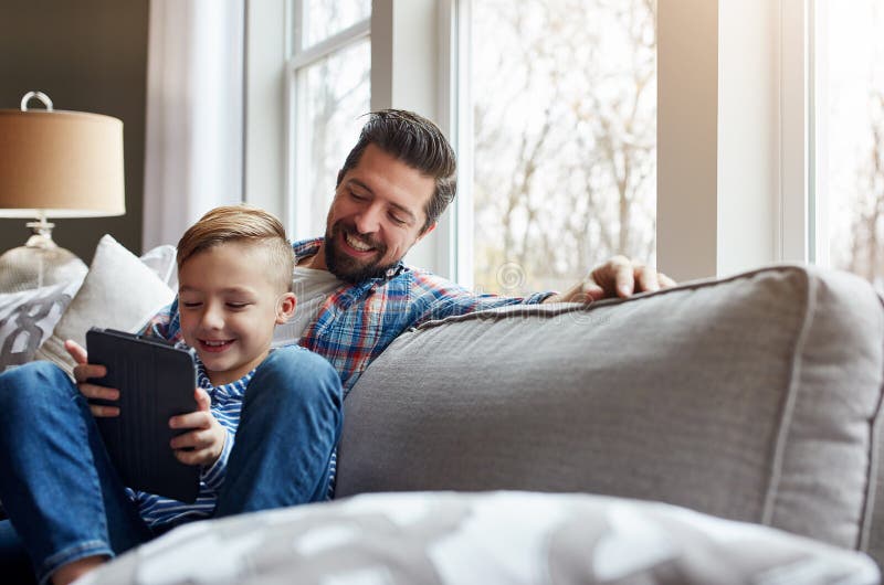 There are Tons of Fun Things To Do Online. a Little Boy Using a Digital ...
