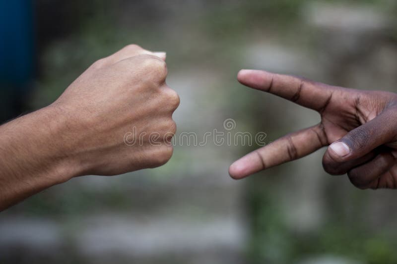 There is Two Peoples Hand and they are Show His Own Hand Style and the ...