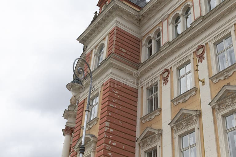 There is a Very Large Building that Features a Clock Tower on the Top ...