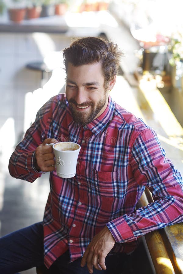 Theres always Time for Coffee. a Young Man Holding a Cup of Coffee in a ...