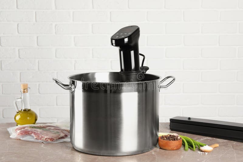 Thermal Immersion Circulator in Pot and Ingredients on Grey Marble ...