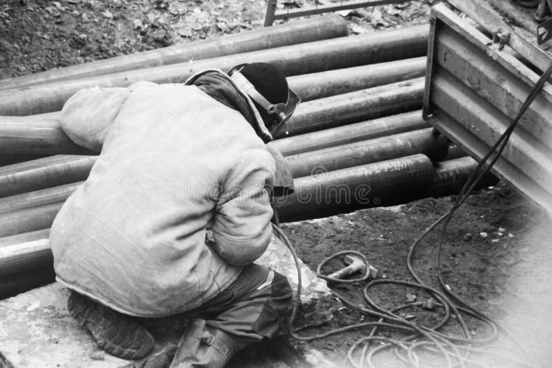 Thermal Insulation. Worker Insulating Heating System Pipes with Foil ...