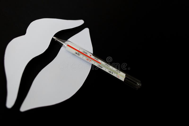 Thermometer with a High Temperature on a Black Background, in White ...