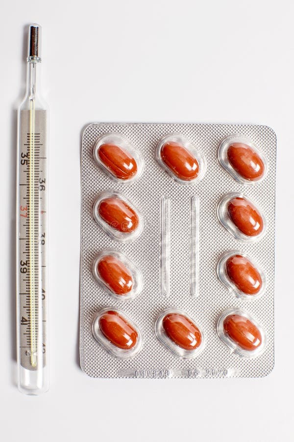 Thermometer for Measuring Body Temperature and Pills for Treatment ...