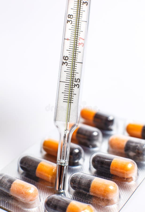 Thermometer for Measuring Body Temperature and Pills for Treatment ...