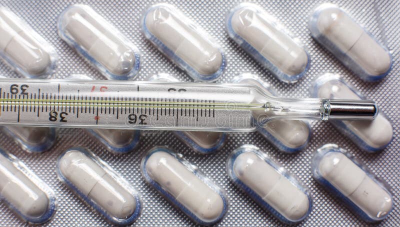 Thermometer for Measuring Body Temperature and Pills for Treatment ...