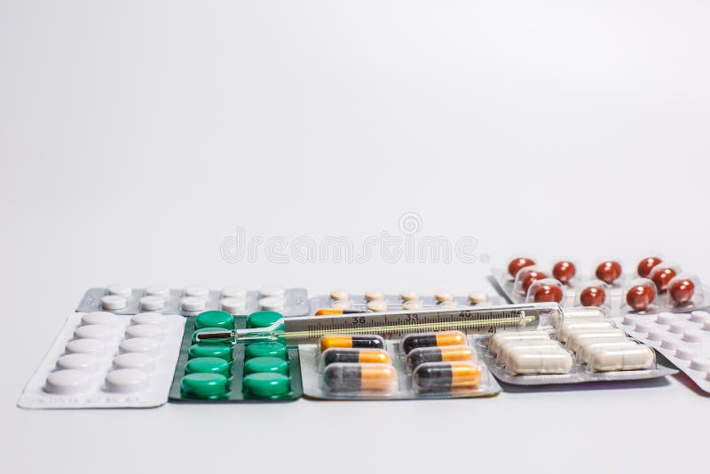 Thermometer for Measuring Body Temperature and Pills for Treatment ...