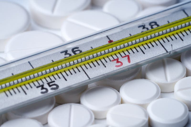 Thermometer for Measuring Temperature on White Tablets Stock Photo ...