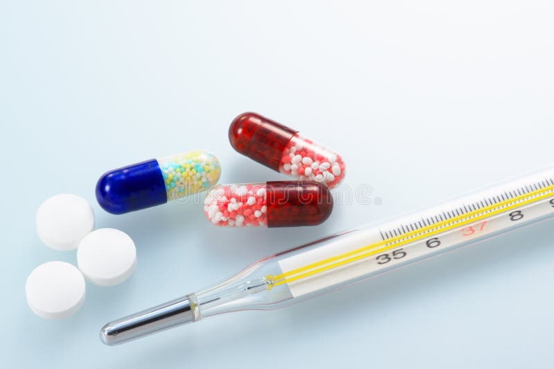 Thermometer and medicines. stock photo. Image of antibiotic - 40005834