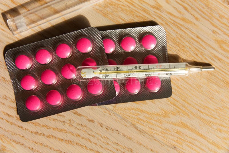 Thermometer and pills stock photo. Image of medical, symbol - 40267634