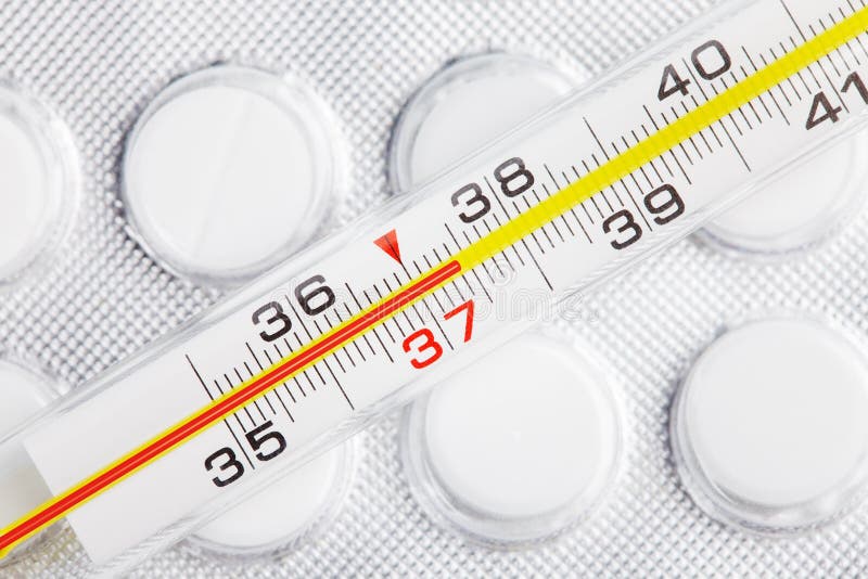 Thermometer on pills stock photo. Image of thermometer - 160047698