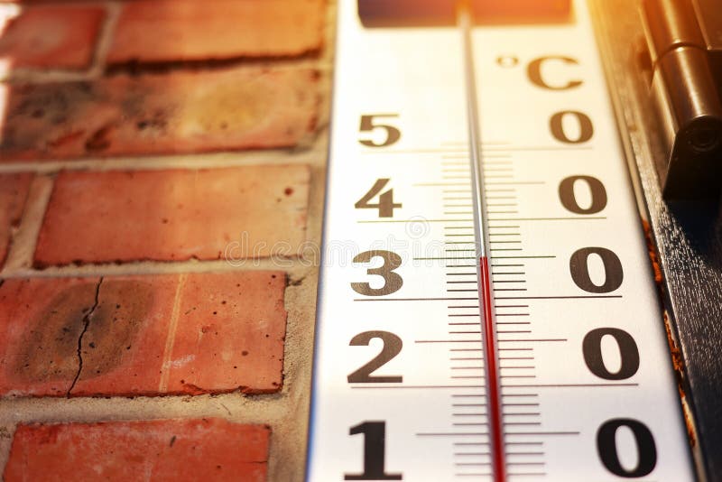 Thermometer Showing High Hot Temperature on Brick Wall Background ...