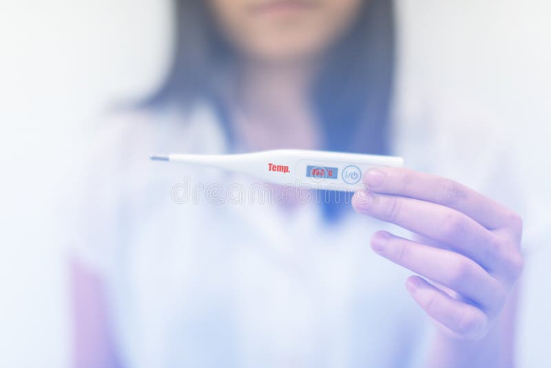 Thermometer Showing High Temperature Stock Photo - Image of hand, fever ...
