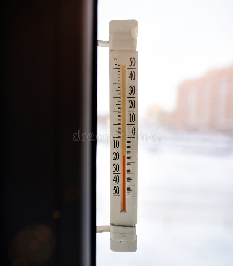 Thermometer Shows a Low Temperature Outdoors. View from the Window ...