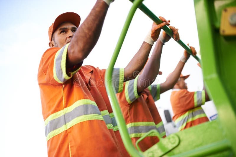 Theyre a Dedicated Team. a Garbage Collection Team at Work. Stock Photo ...
