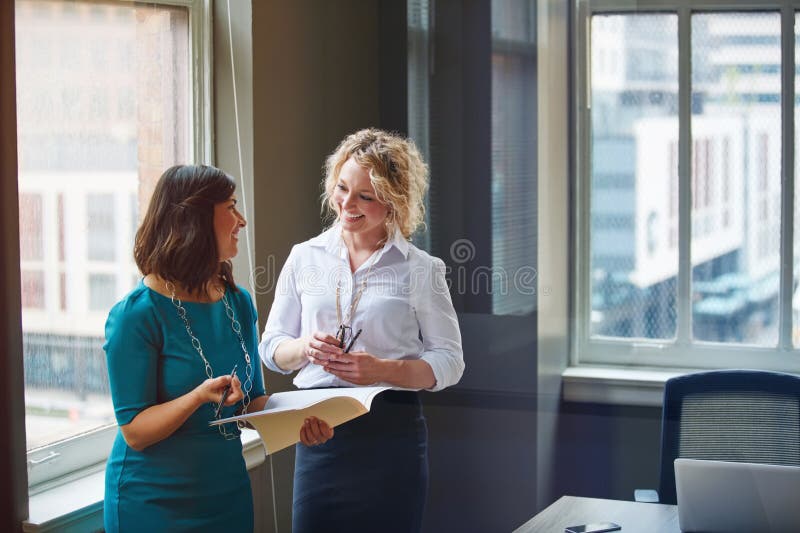 Theyre Proactive in Problem Solving. Two Businesswomen Going Over ...