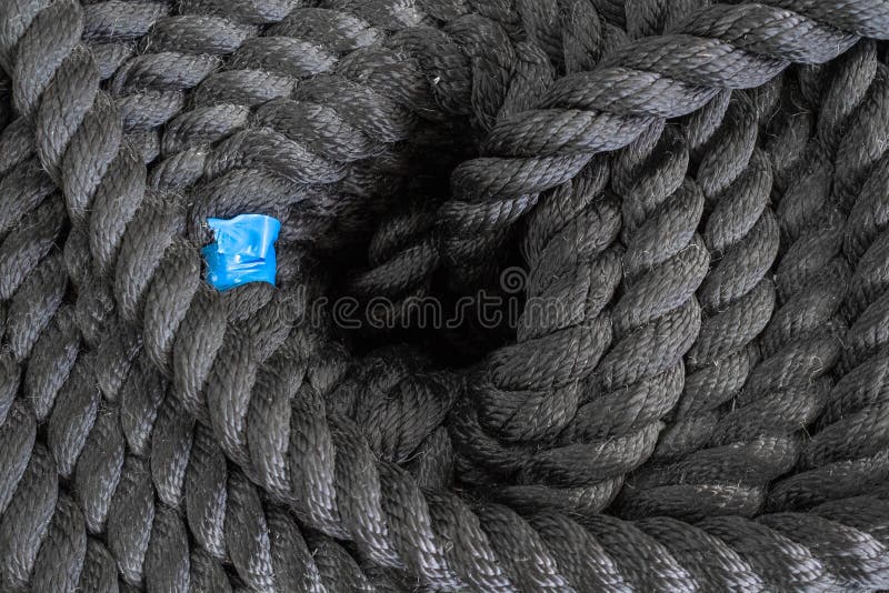 The Thick Black Rope Twisted in a Roll. the Top View on a Rope Spiral ...