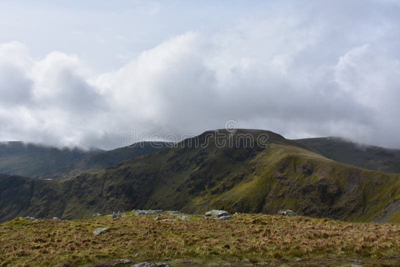 Thick Clouds Hovering Over the Fell Summit Stock Photo - Image of coast ...