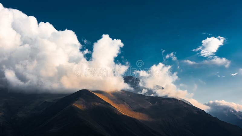 Thick Clouds Over the Mountain Peak Stock Image - Image of atmospheric ...