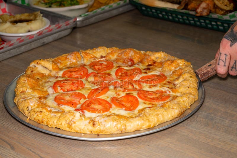 Thick Deep Dish Crust Cheese Pizza with Big Bright Red Tomatoes Stock ...