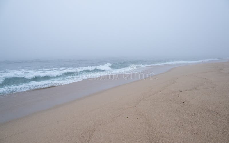 Thick, Dense Fog Over the Ocean As Waves Break on the Empty Beach ...