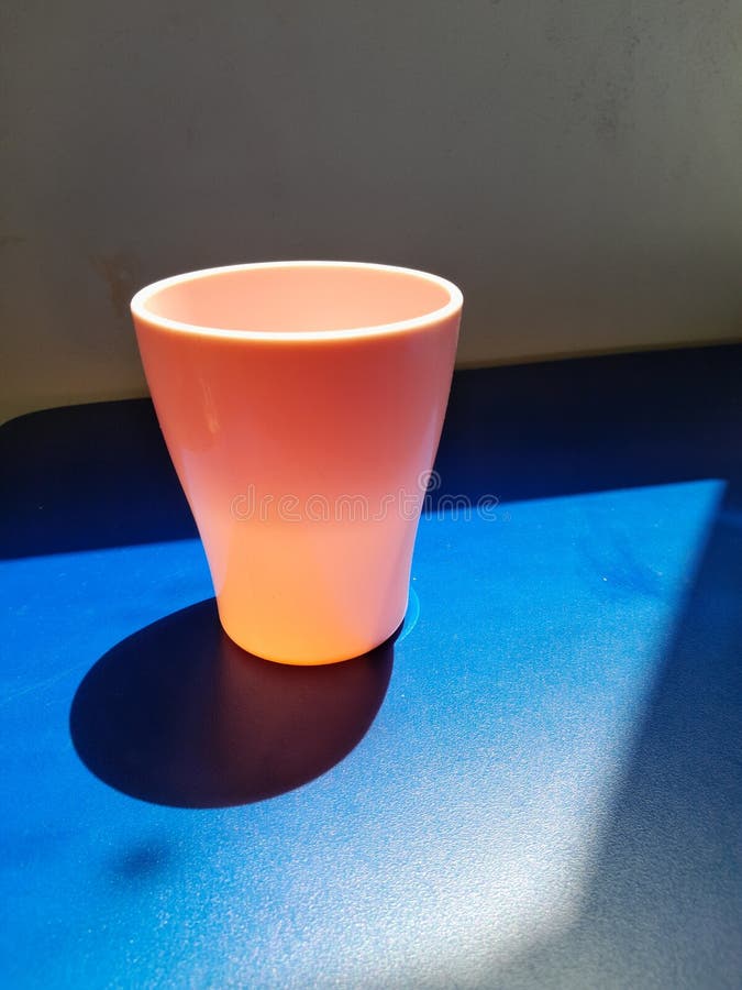 A Thick Glass of Pink Placed in the Searing Sun Stock Image - Image of ...