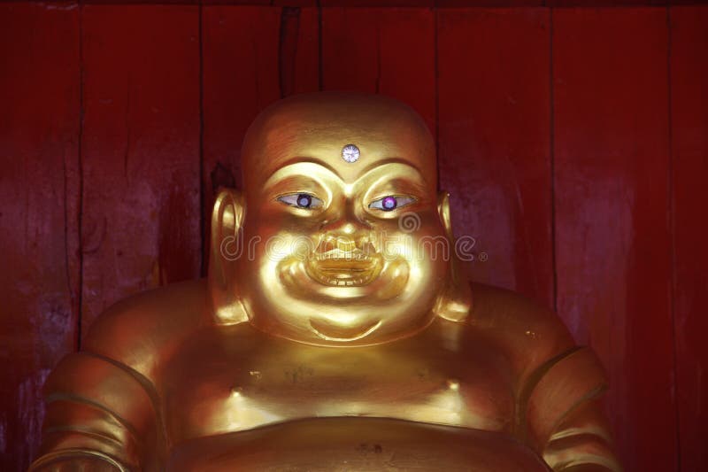 Thick, Golden Buddha with a Gem Stock Photo - Image of spirituality ...