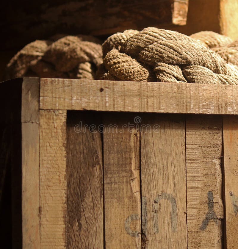 A Thick Heavy Woven Rope Lying on a Wooden Crate. Stock Image - Image ...