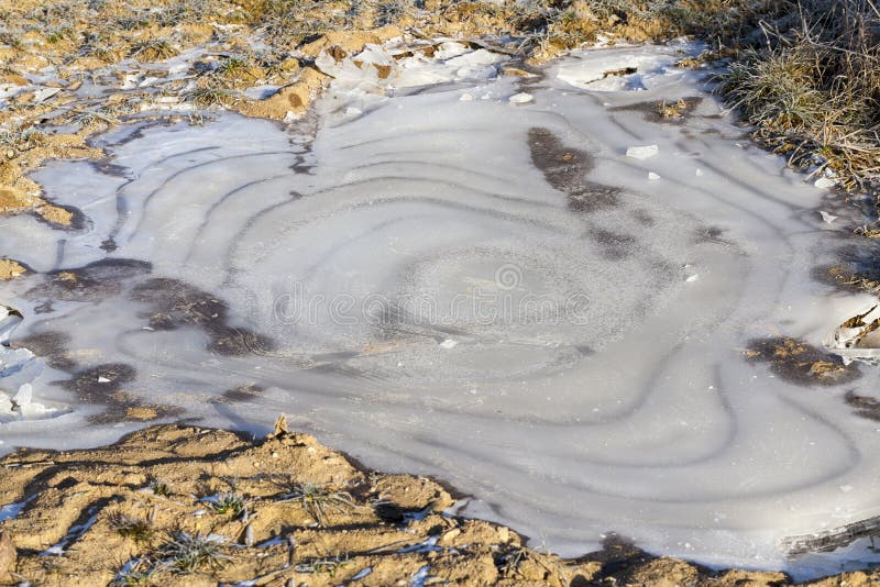 A Thick Layer of Ice Formed on the Territory of the Field Stock Photo ...