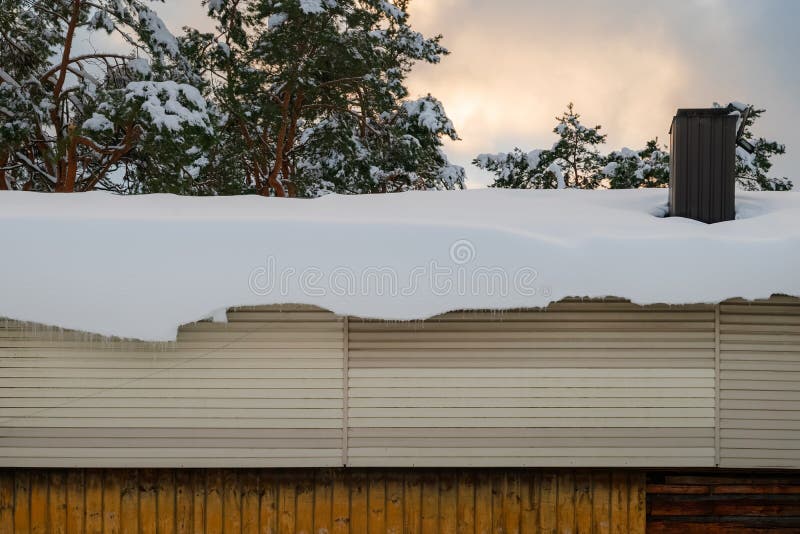 Thick Layer of Snow Hanging Off the Edge of the Roof Stock Image ...