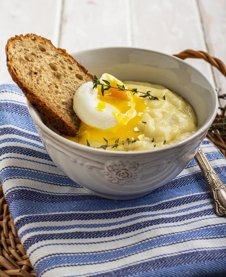 Thick Mashed Potatoes with Poached Egg and a Slice of Bread Thyme Stock ...