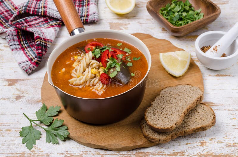 Thick red soup with pasta stock photo. Image of bowl - 134021342