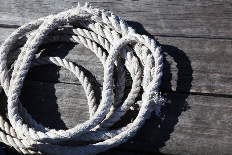 Thick rope on a boardwalk stock photo. Image of detail - 90553776