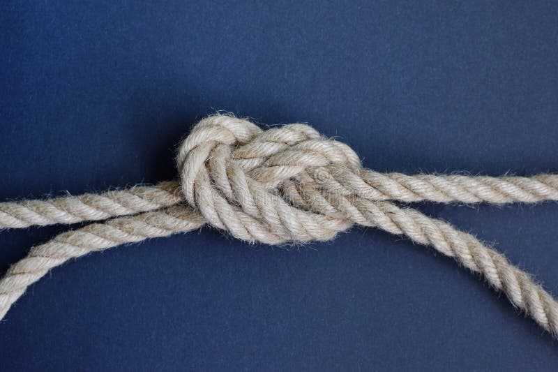 Thick Rope Knot on Blue Background. Hemp Rope with Knot Stock Photo ...