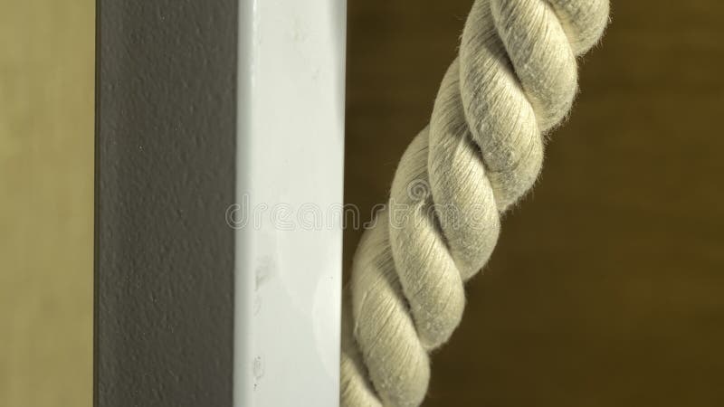 Thick Rope and a Metal Pipe Close-up Stock Photo - Image of hardwood ...