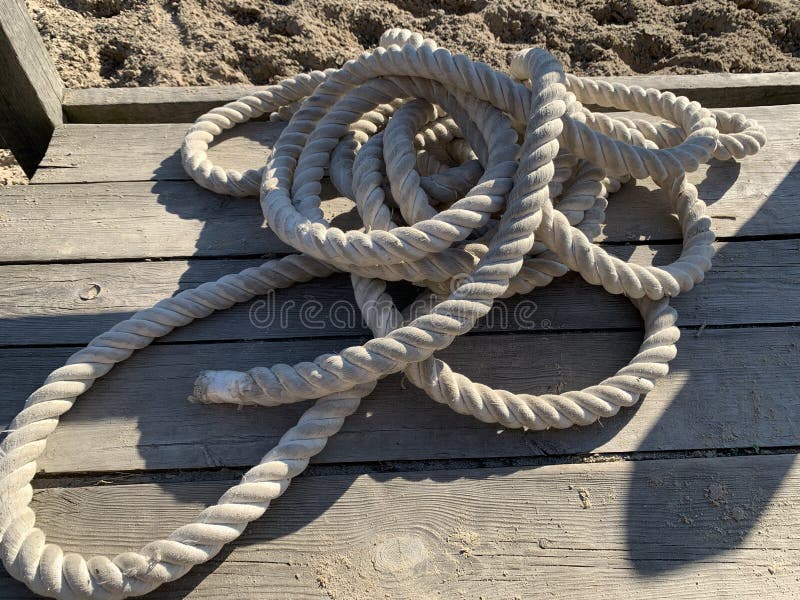 Thick Rope on the Wooden Floor. Sturdy Rope on a Plank Platform ...