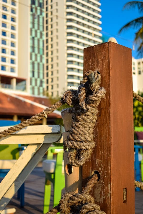 Thick Rope on Wooden Pole for Mounting on a Pier Stock Image - Image of ...