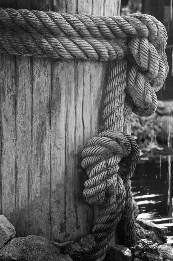Thick Rope Wrapped Around a Post Stock Image - Image of pond, white ...