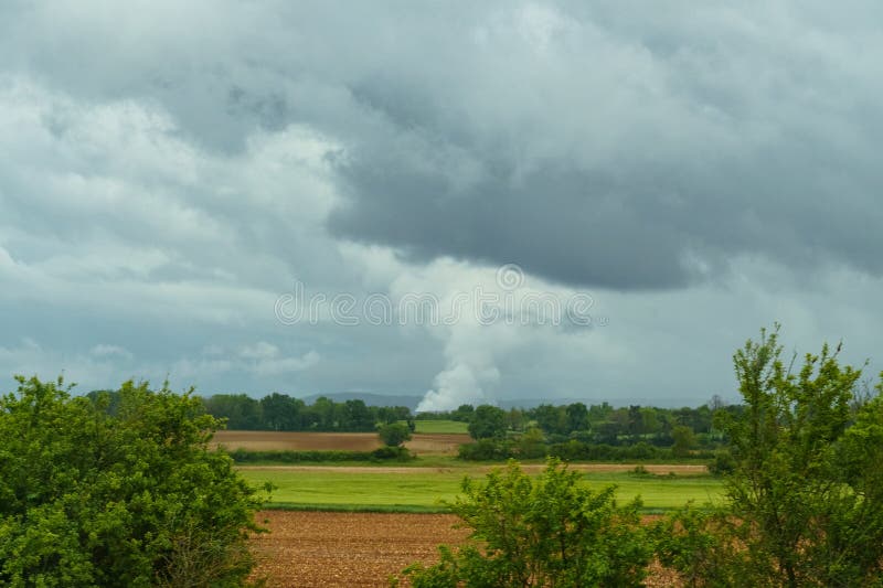 Thick Smoke Caused by Combustion - a Fire Behind the Forest. Stock ...